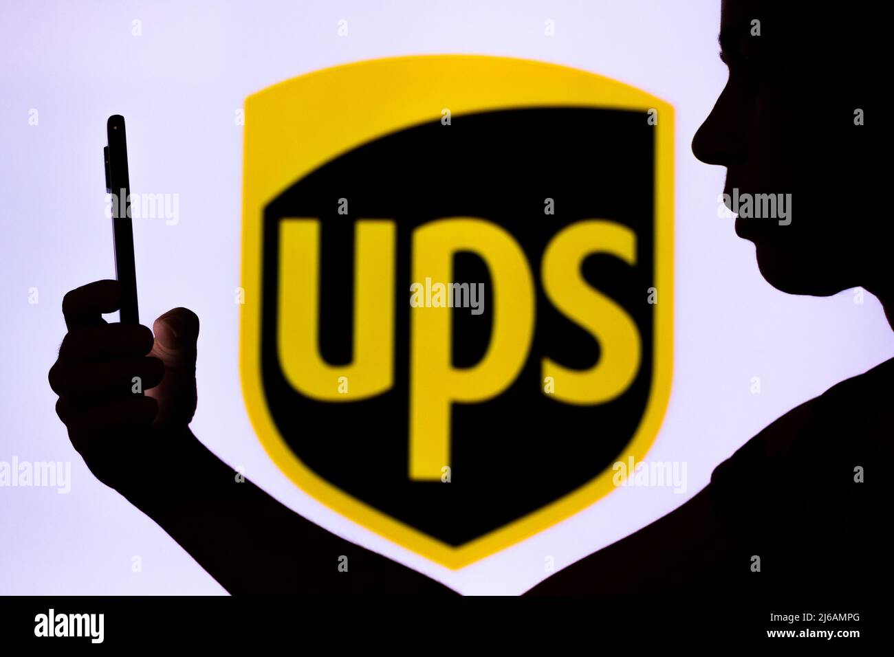 In this photo illustration, the United Parcel Service (UPS) logo is ...
