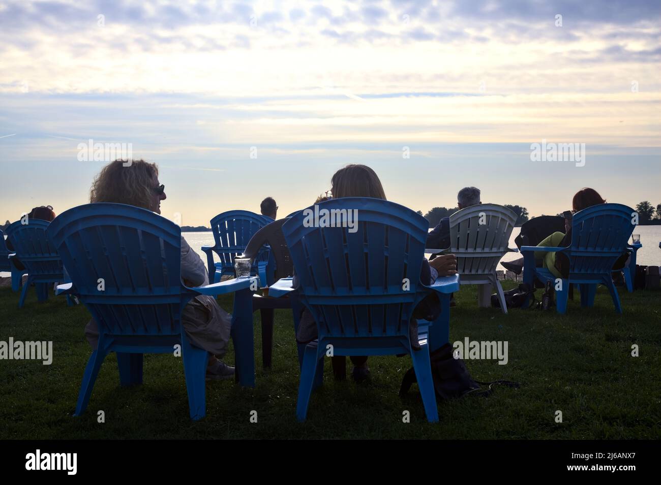 Woman laying on lounge chair hi-res stock photography and images - Alamy