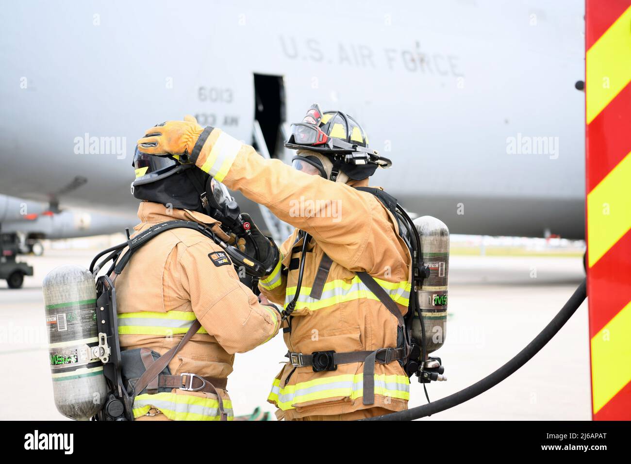 902nd Civil Engineer Squadron firefighters prepare to enter a 433rd ...