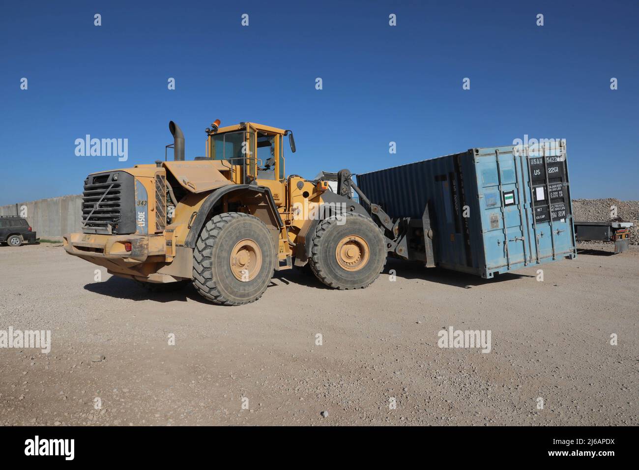 A U.S. Soldier downloads equipment in Syria Apr. 21, 2022, as part of a ...