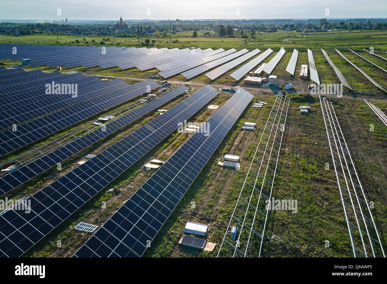 Aerial view of big electric power plant under construction with many ...