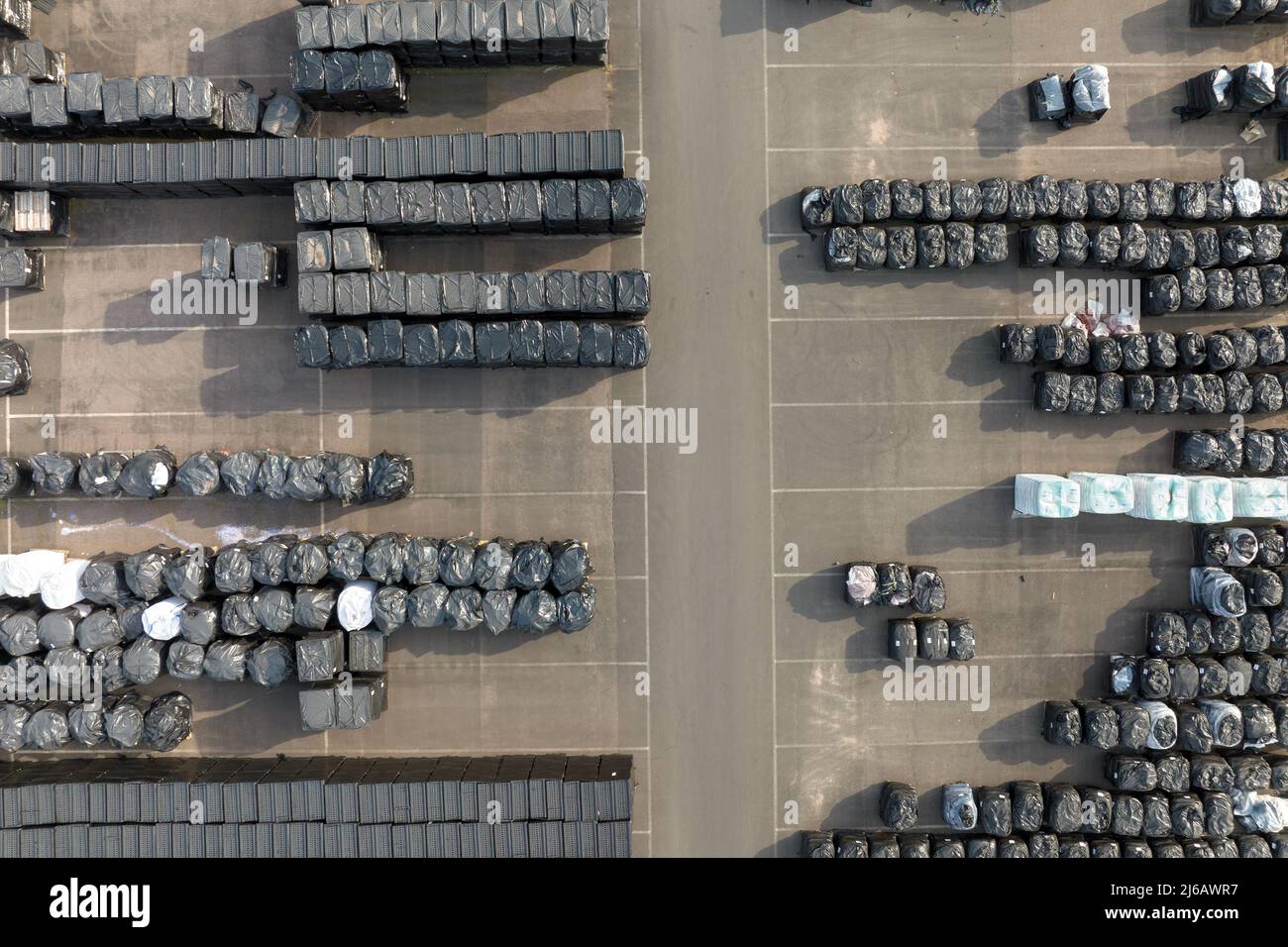 Aerial view of goods storage on warehouse yard and logistics center in industrial zone from ...