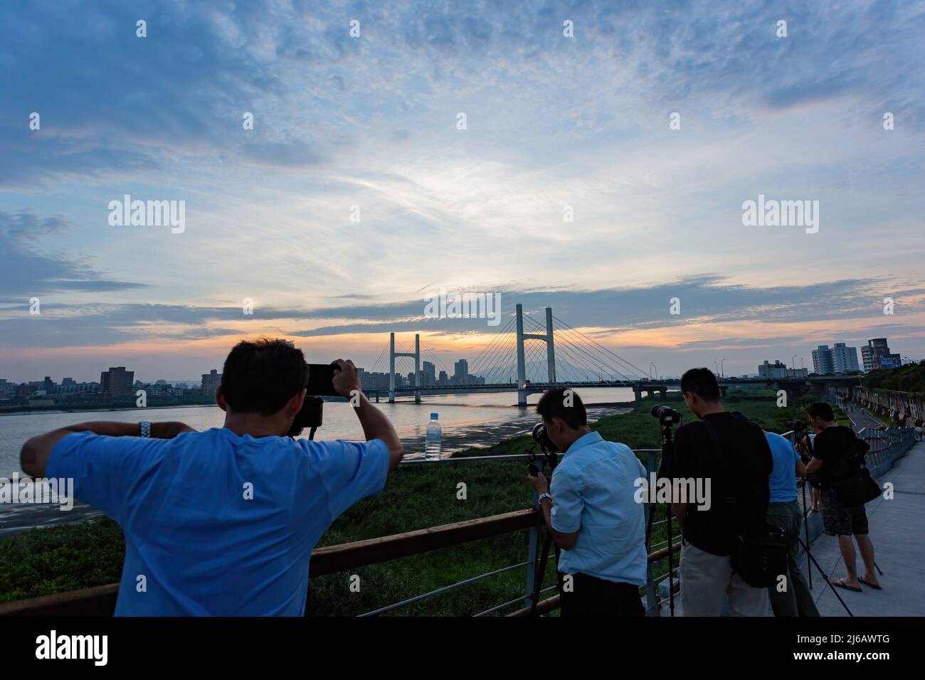 Taipei, JUN 26 2013 - Photographer taking picture of the twilight view ...