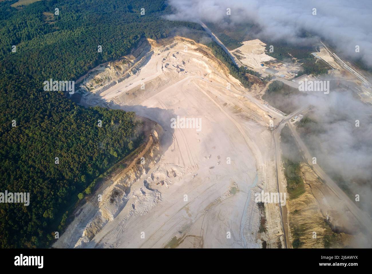 Aerial view of open pit mining of limestone materials for construction ...