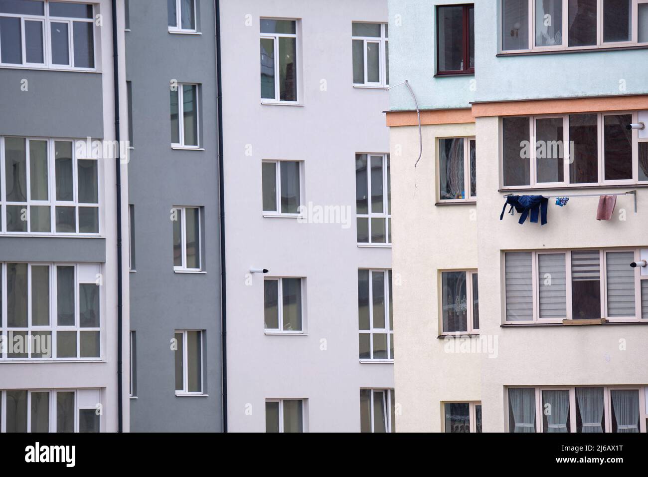 Architectural details of modern high apartment building facade with ...