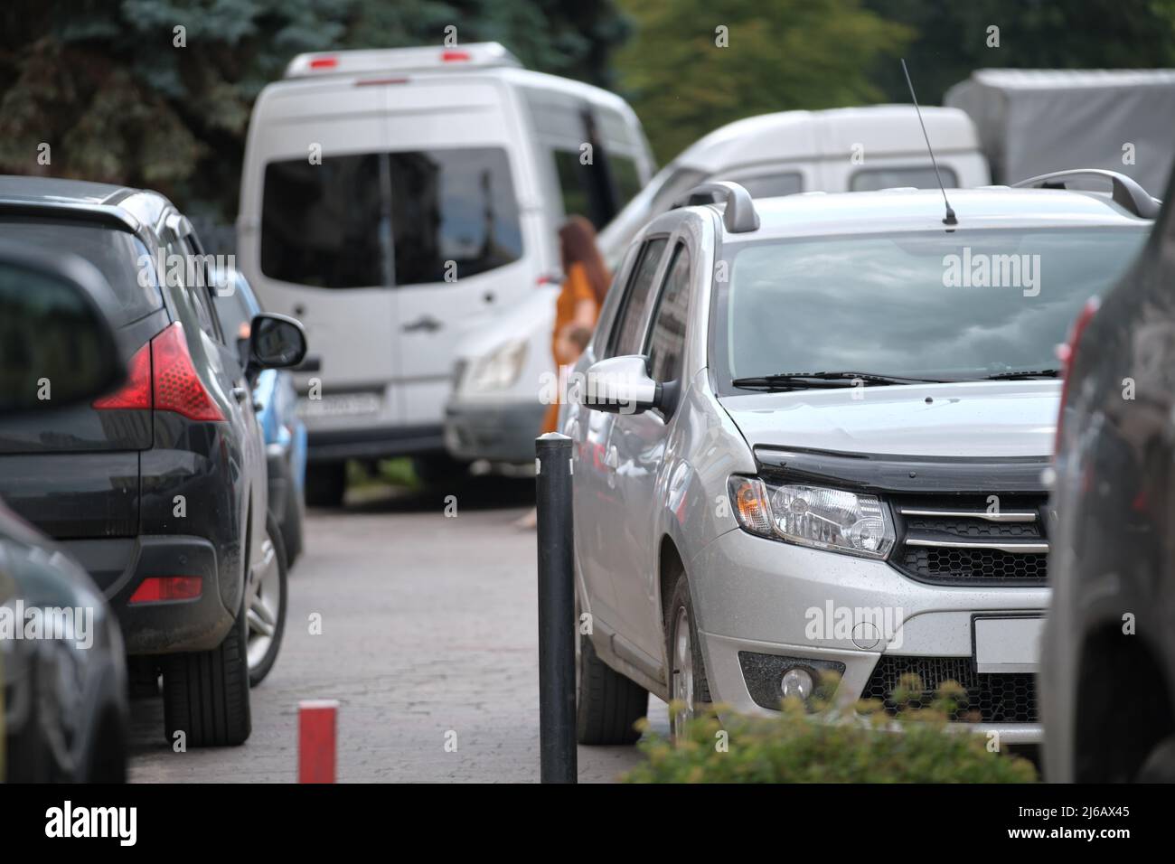 Cars parked in line on city street side. Urban traffic concept Stock ...