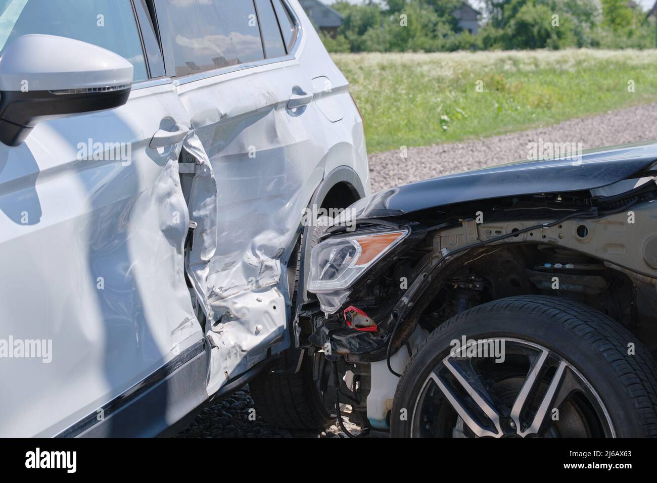 Damaged in heavy car accident vehicles after collision on city street ...