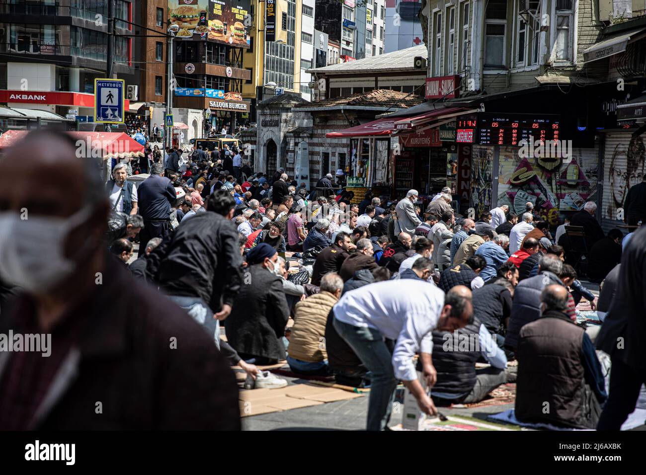 Muslims offer last Friday prayers of Ramadan outside a mosque in ...