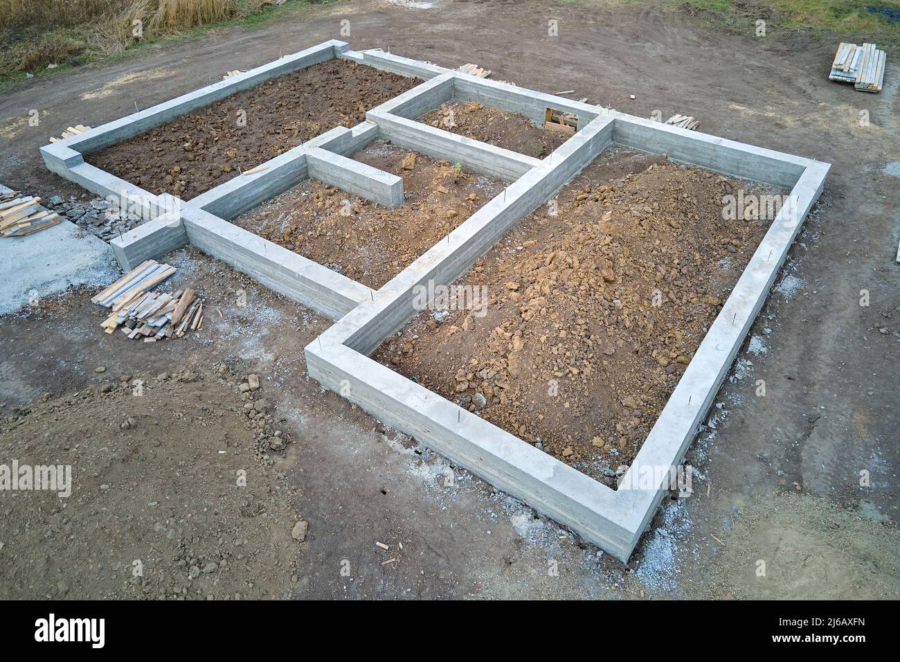 Top down aerial view of building works of new house concrete foundation ...