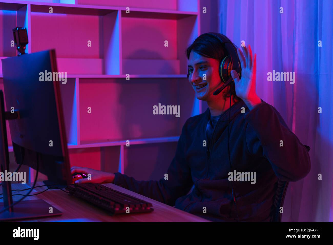 Game stream concept, Male streamer play game online and greeting with ...