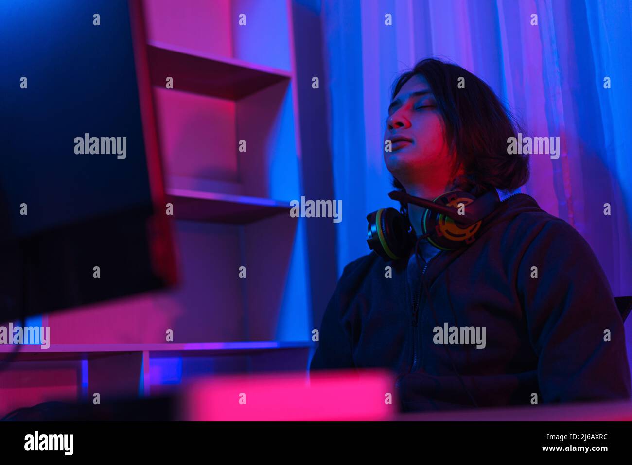 Gamer stream concept, Male streamer taking a break to rest after live ...