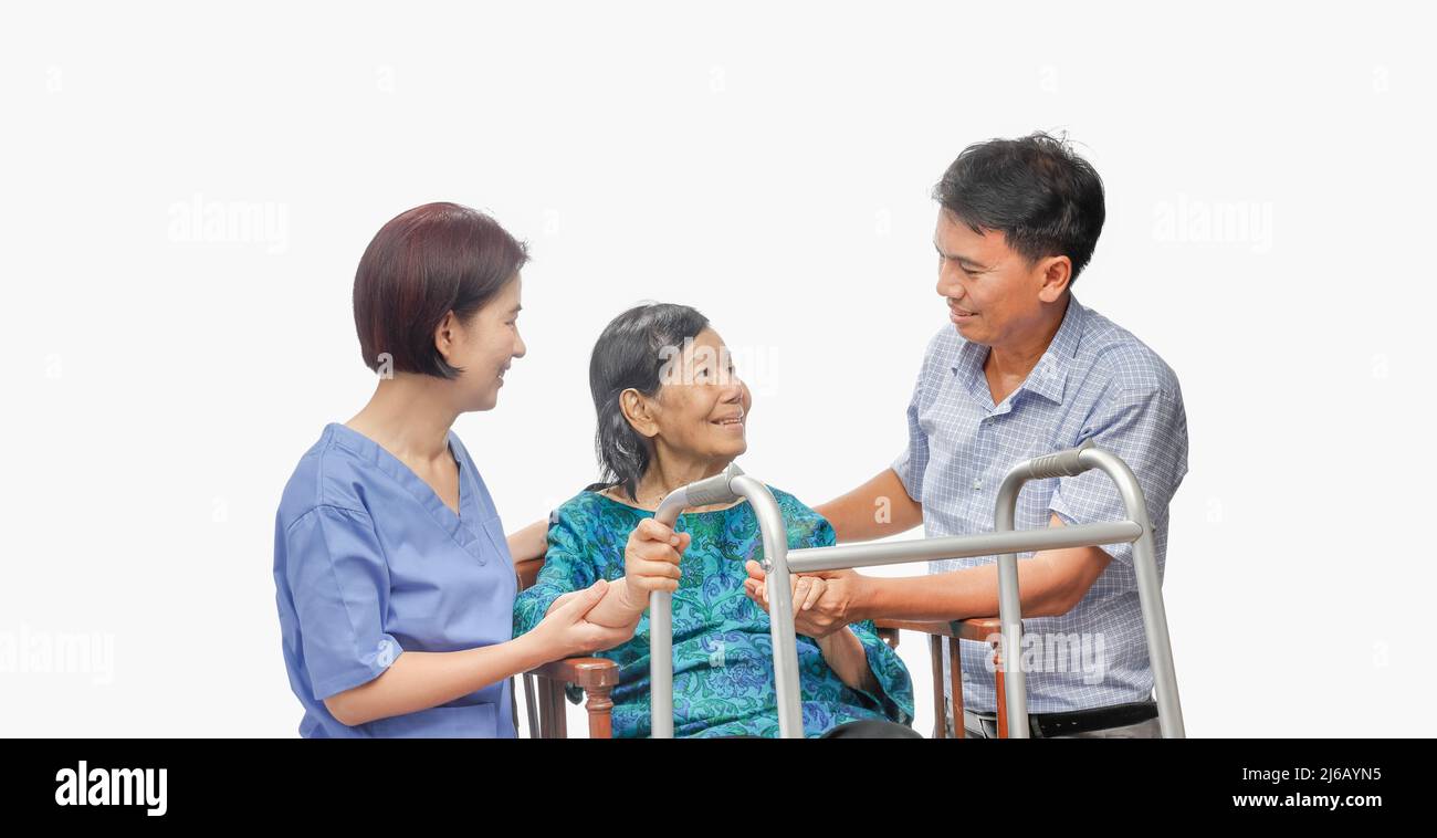 Son looking after elderly mother on wheelchair with caregiver Stock ...