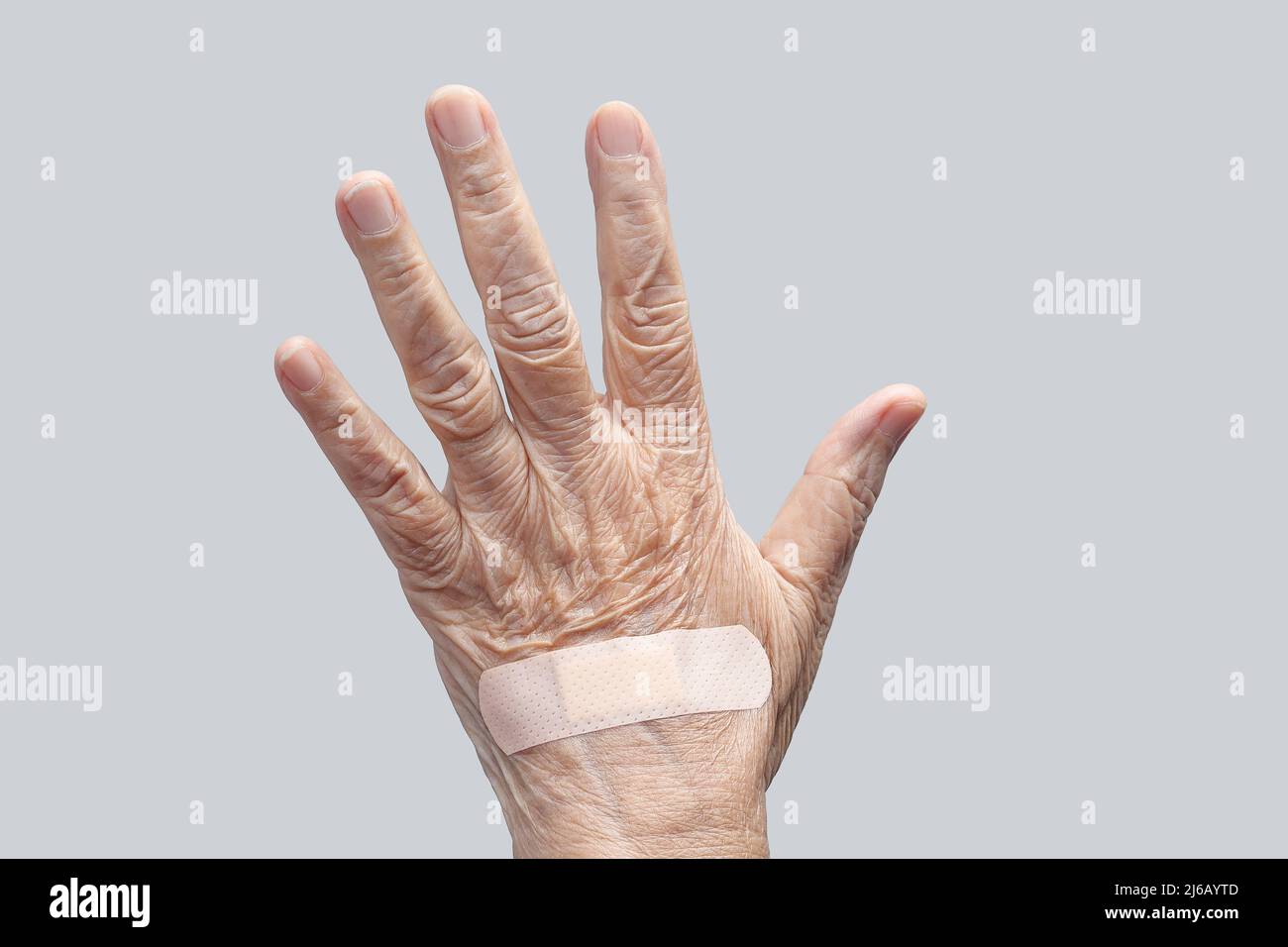 Elderly woman adhesive bandage on her hand Stock Photo - Alamy