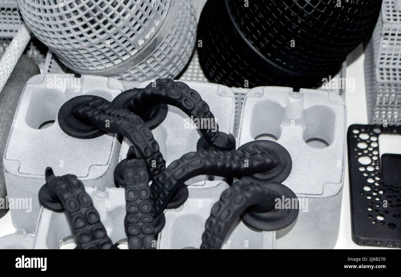 Models printed on 3D printer. Black objects printed on 3D printer made ...