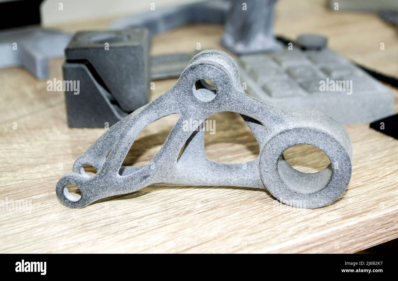 Models printed on 3D printer. Gray objects printed on 3D printer made ...
