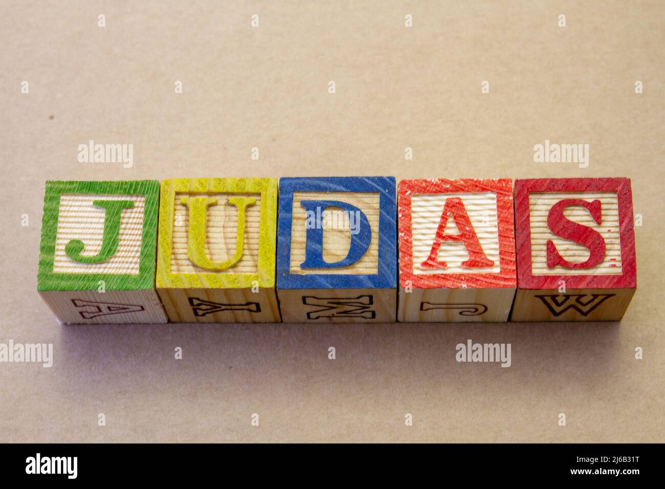 The term judas visually displayed on a clear background with copy space ...