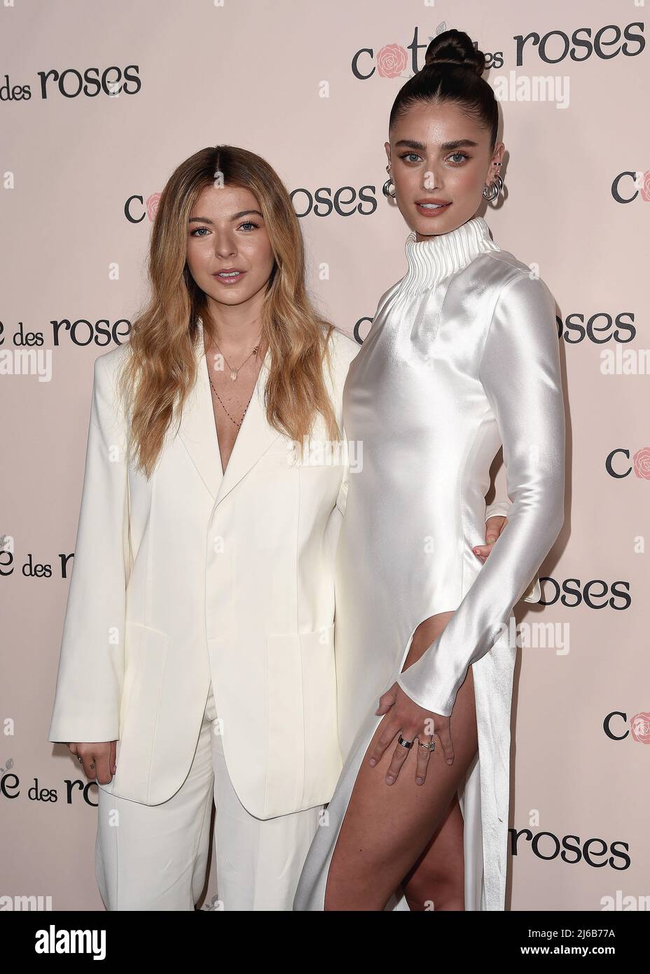 Emma Bertrand and Taylor Hill walking on the red carpet at the Cote de ...