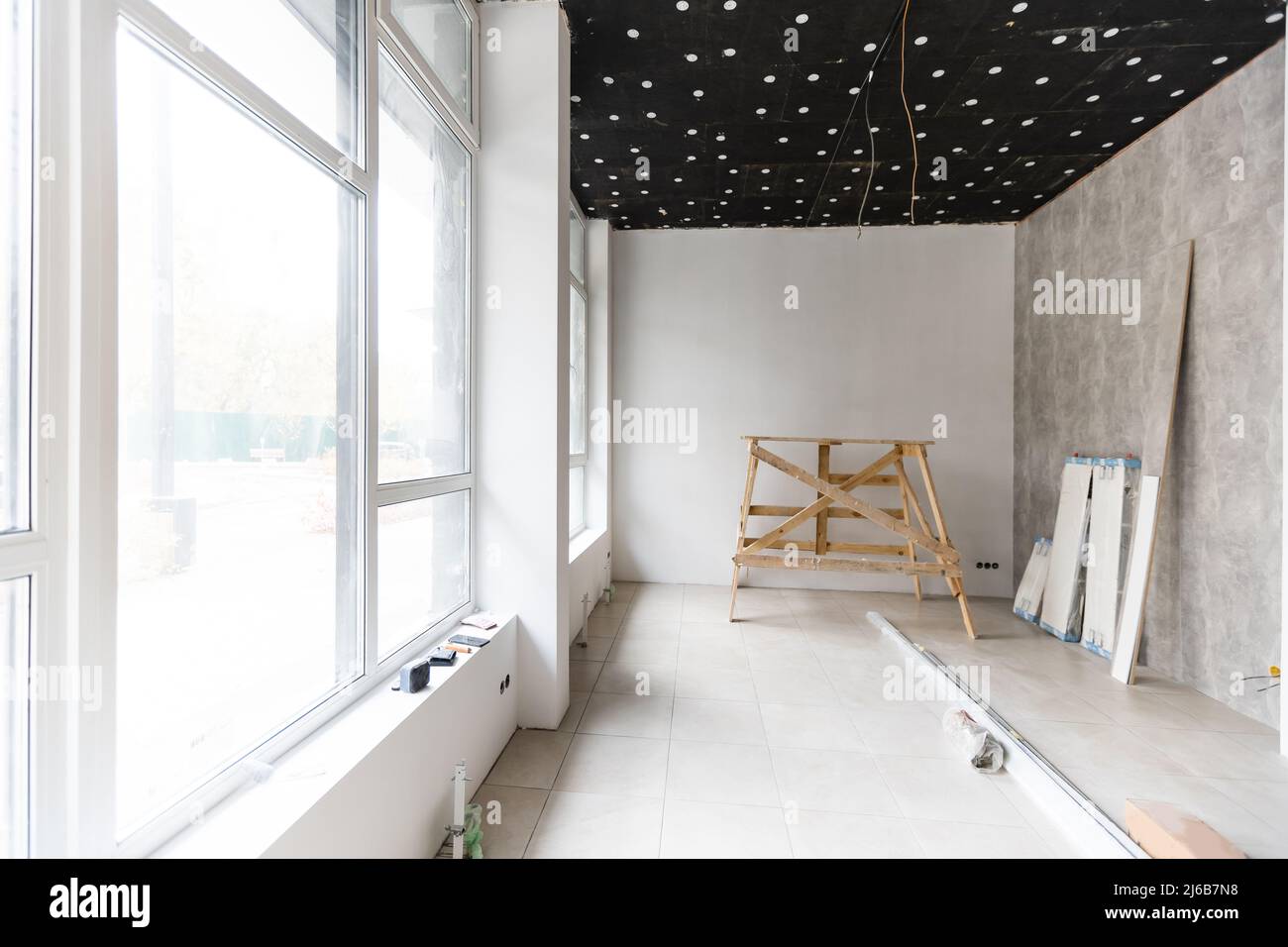 renovated room with shopping window - empty store shop with wooden ...