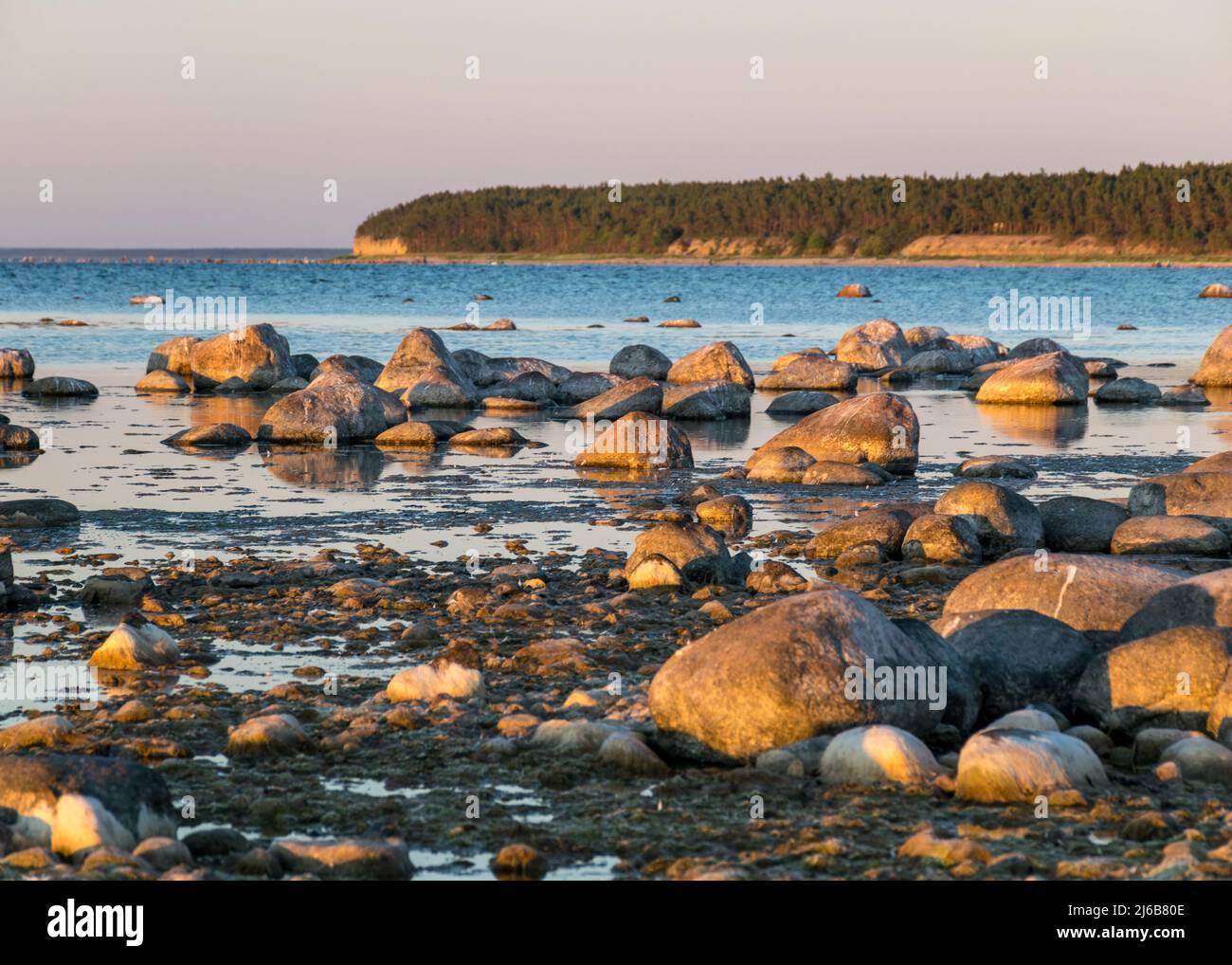 beautiful sunset landscape from a traditional rocky beach on the island ...
