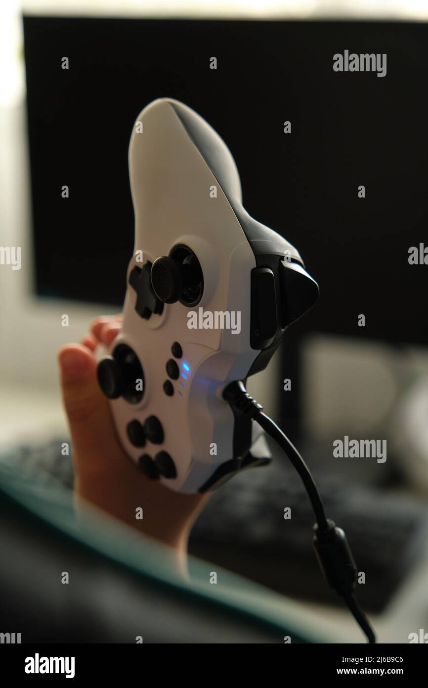 Child hands computer game console hi-res stock photography and images ...