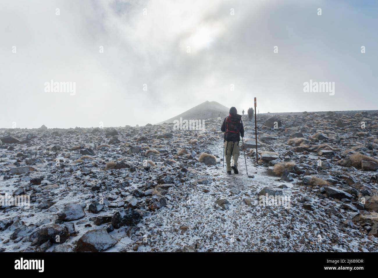 Hiking the steep scree terrain to the Red Crater in the heavy fog on ...