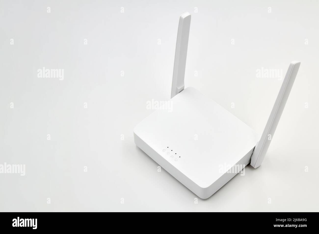 White wireless router on light background. Close-up Stock Photo - Alamy