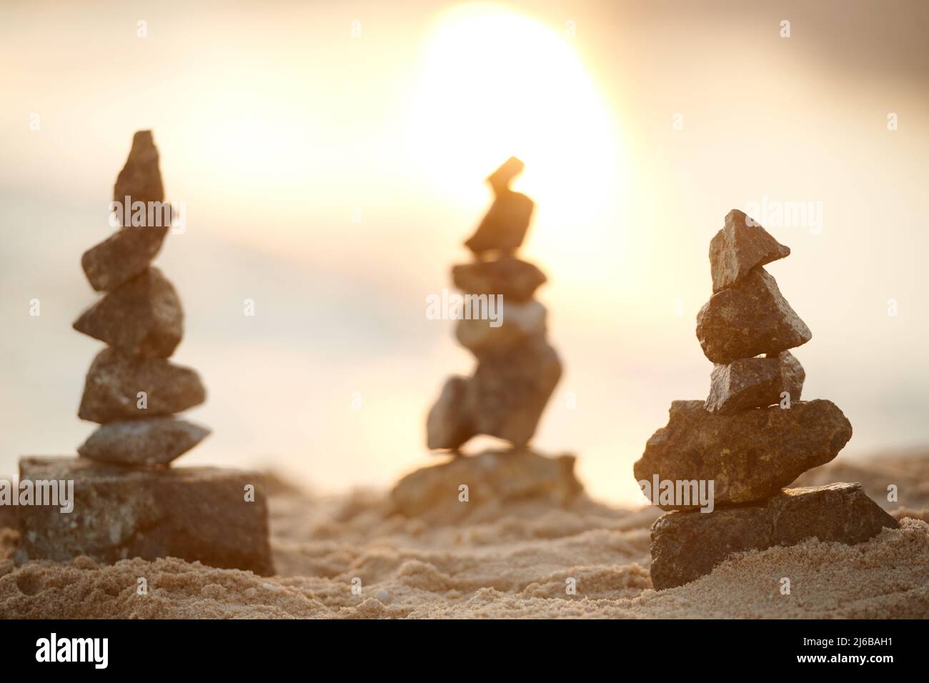 Stone pyramids on the beach at sunset hi-res stock photography and ...