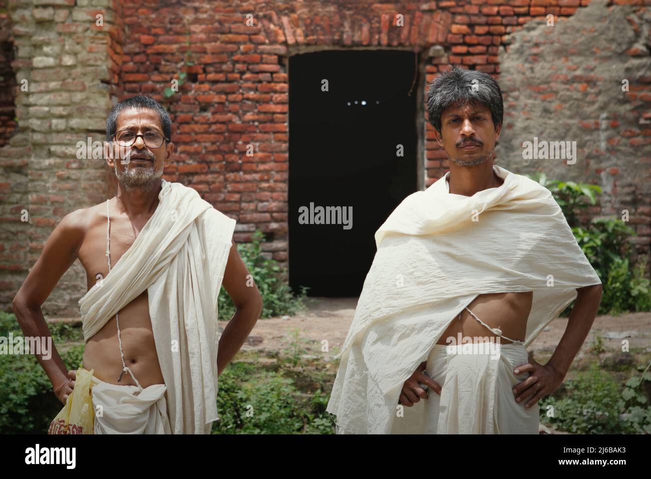 Portrait of religious men in front of the ruins of Tamluk rajbari on ...