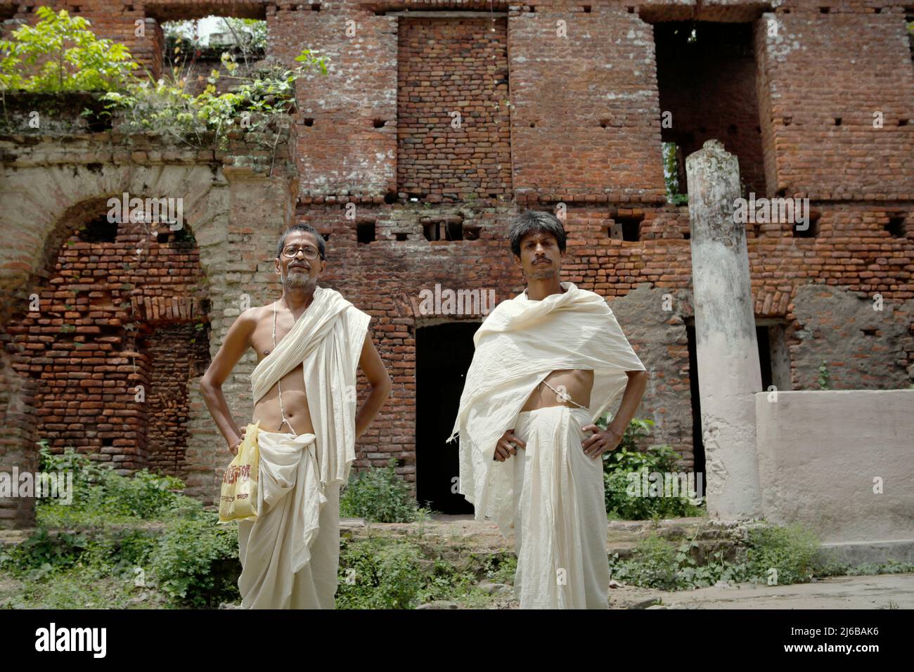 Portrait of religious men in front of the ruins of Tamluk rajbari on ...