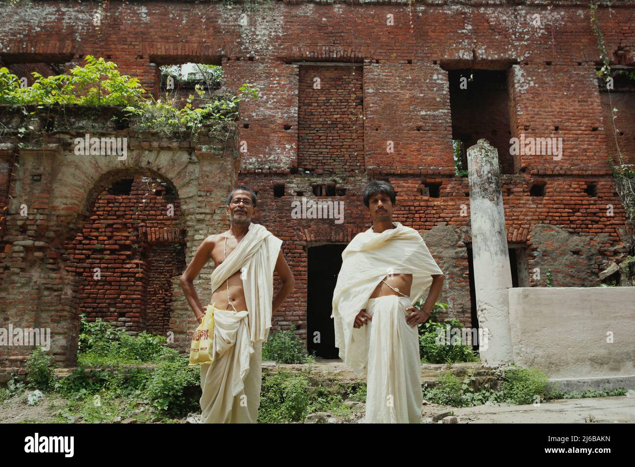 Portrait of religious men in front of the ruins of Tamluk rajbari on ...