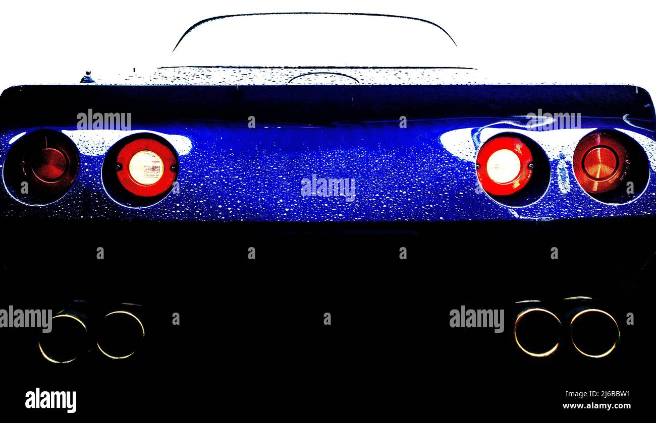 Rear view of a modern sportscar. The red rear lights are visible and ...