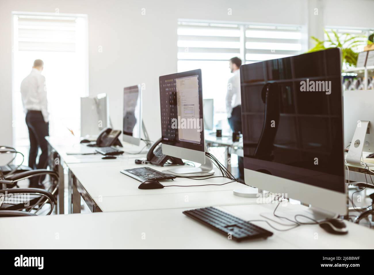 Interior of a modern light small company office. Workspace, office ...