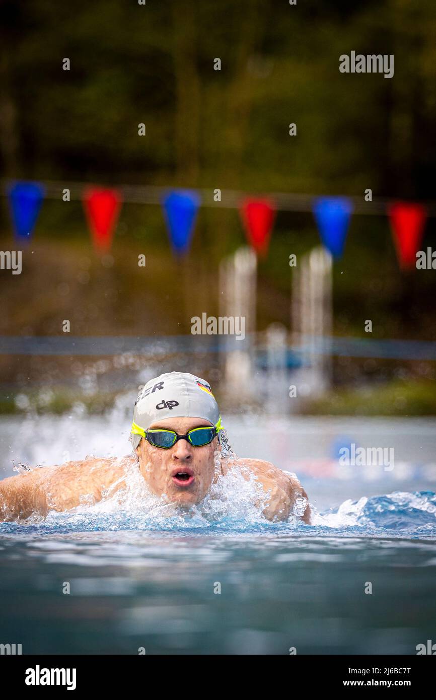 30 April 2022, Lower Saxony, Wolfsburg: A man swims in the pool of the ...