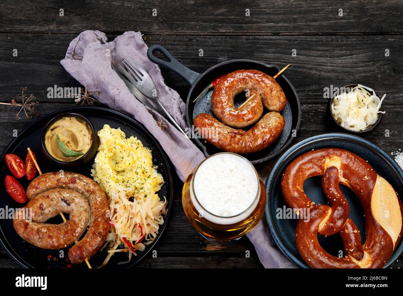Grilled German sausages on wooden background. Traditional food concept ...