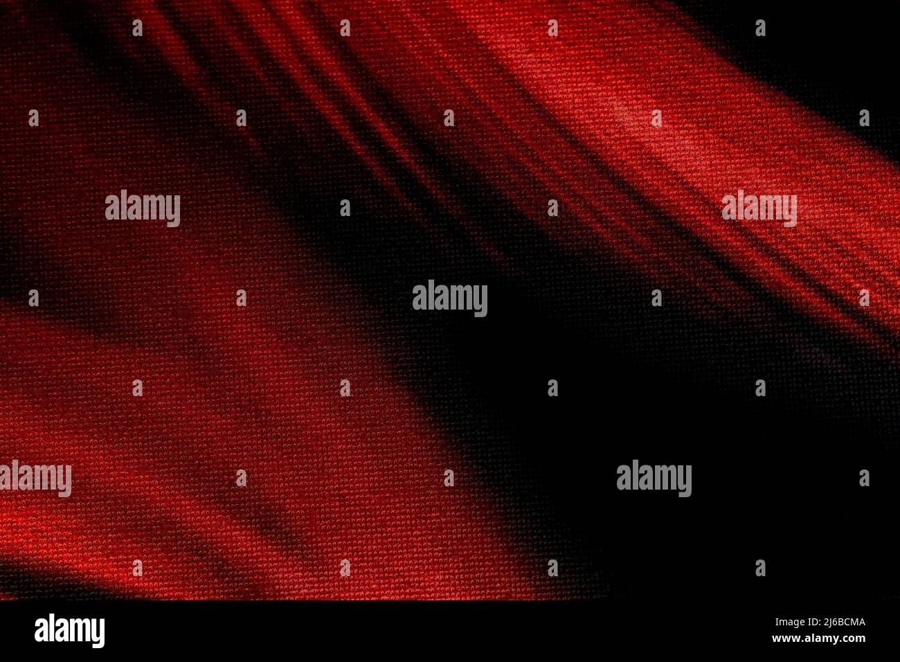 Abstract background in black and red. The red parts have a soft ...