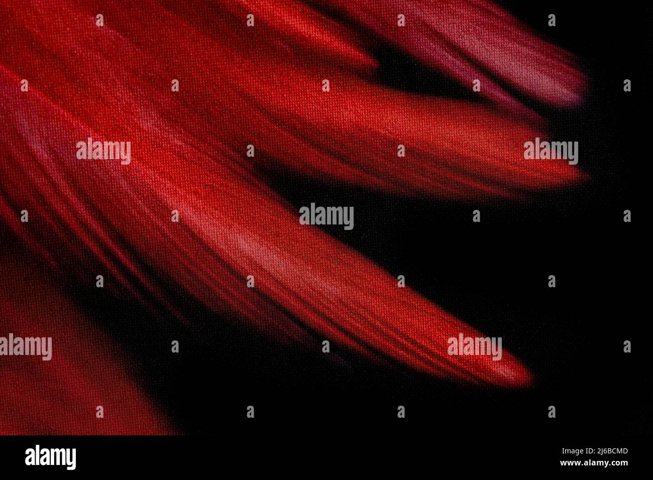 Abstract background in black and red. The red parts have a soft ...