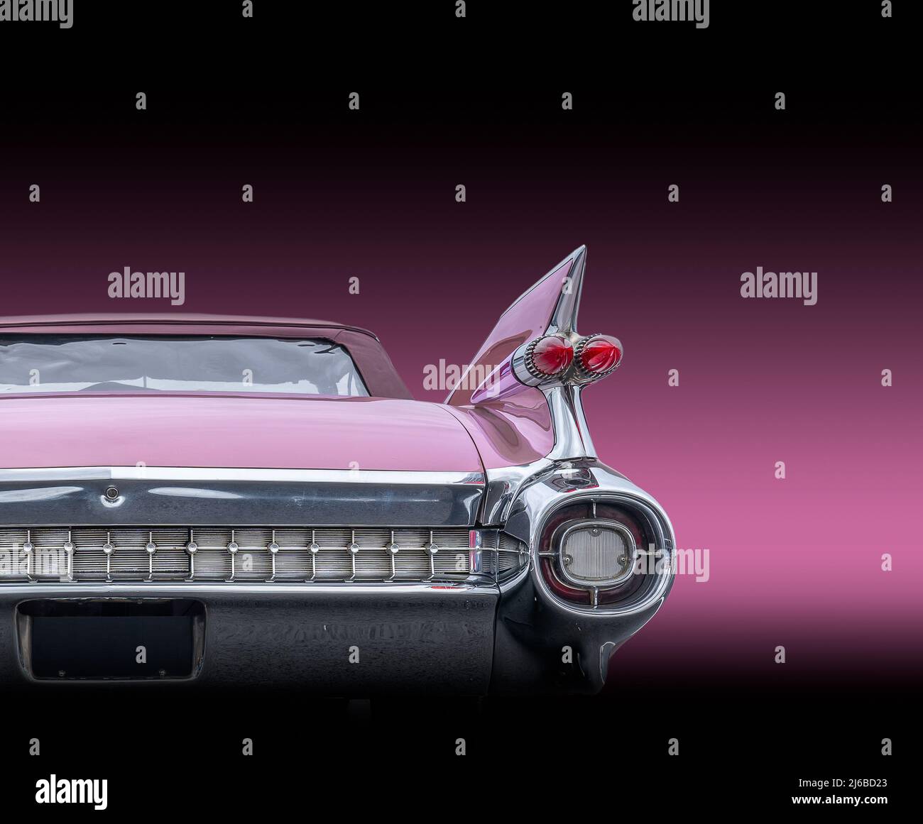 Isolated back side of a pink classic american car from the fifties ...