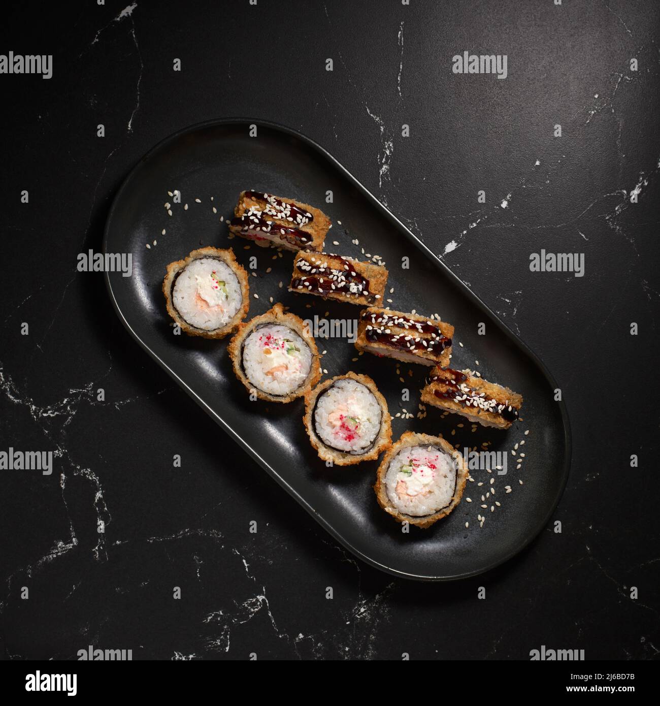 Hot fried sushi rolls and maki with shrimp , cream cheese, avocado and ...