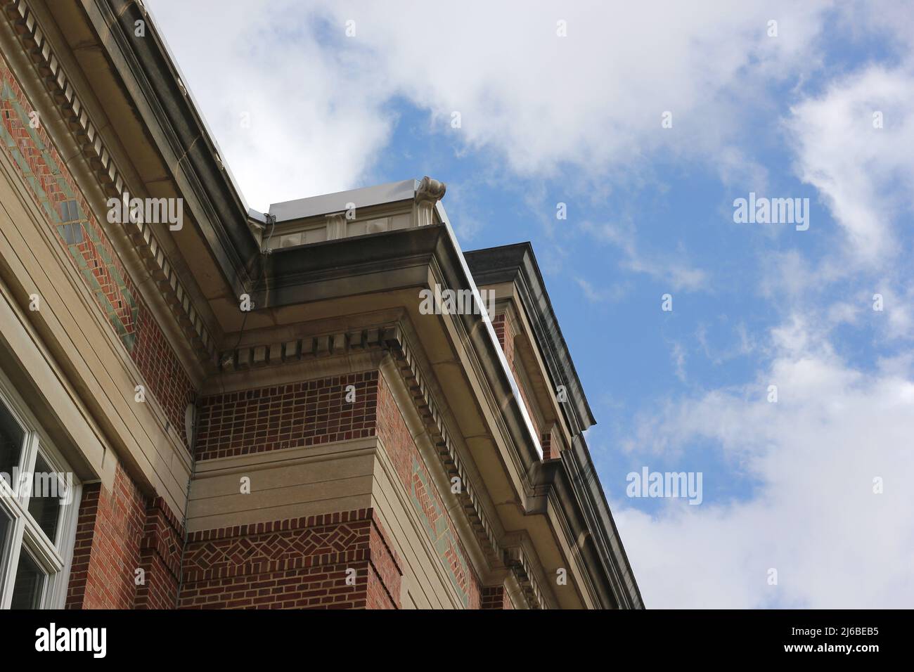 Elaborate and ornate roof cornice of a traditional colonial building ...