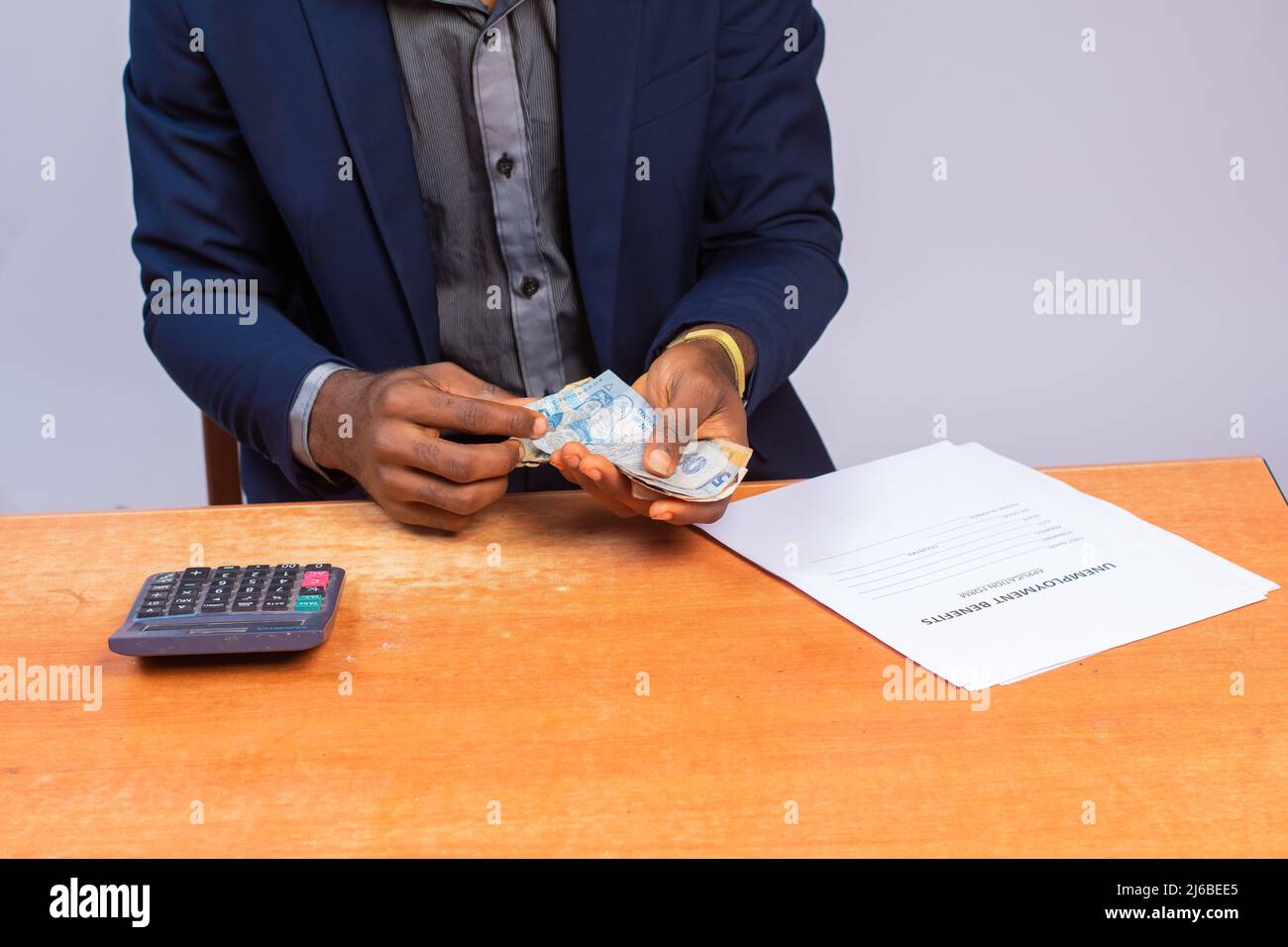 close up a business man counting and calculating money Stock Photo - Alamy