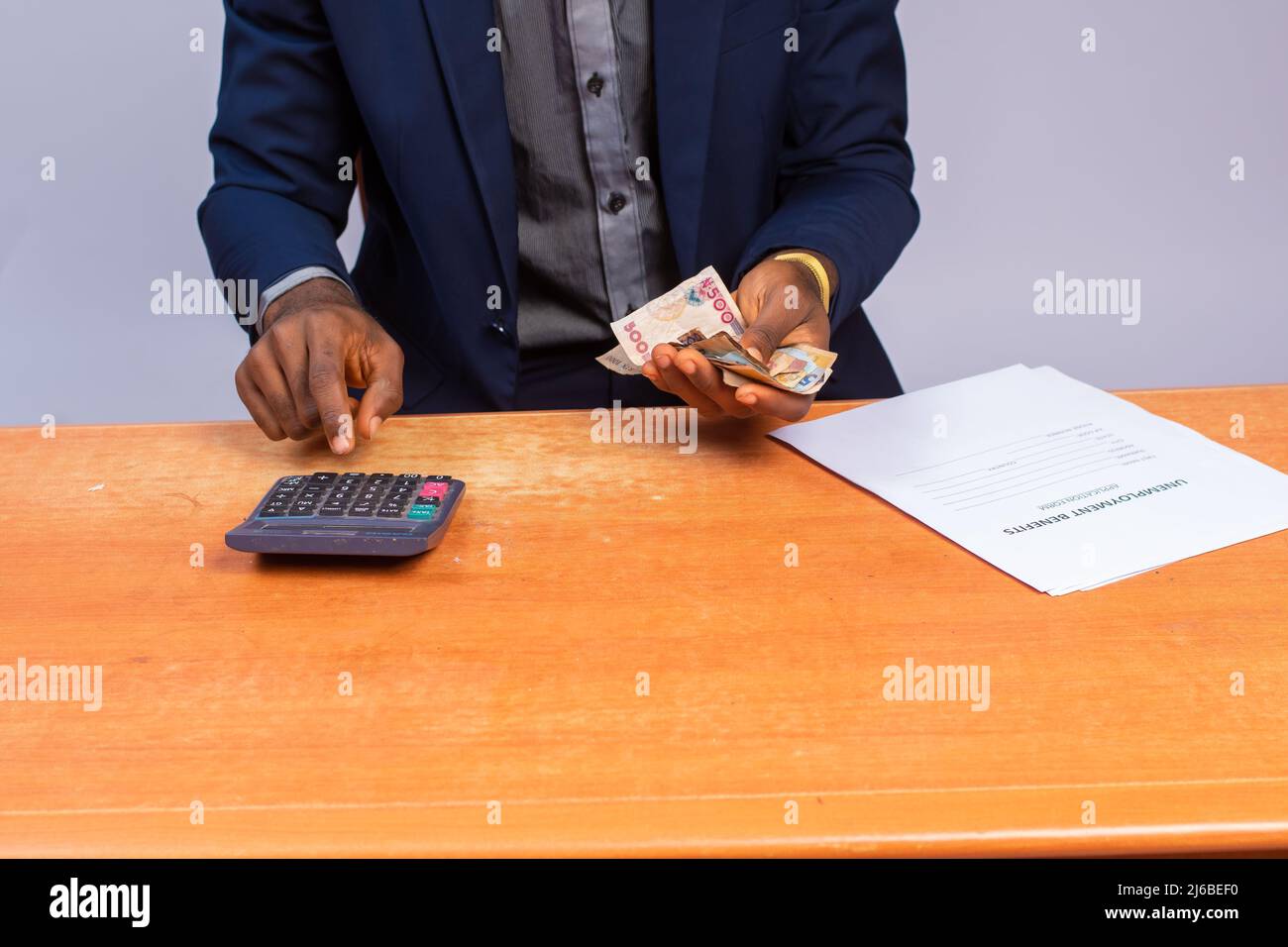 close up a business man counting and calculating money Stock Photo - Alamy