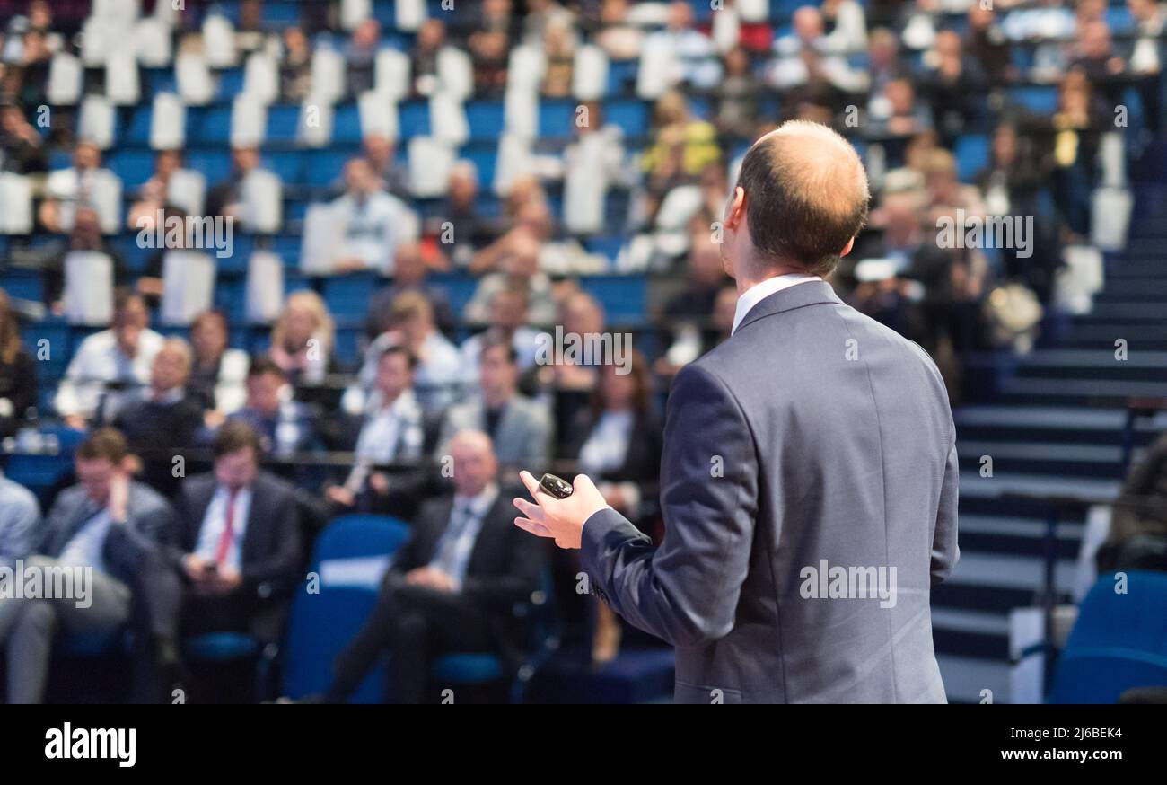 Public speaker giving talk at Business Event Stock Photo - Alamy