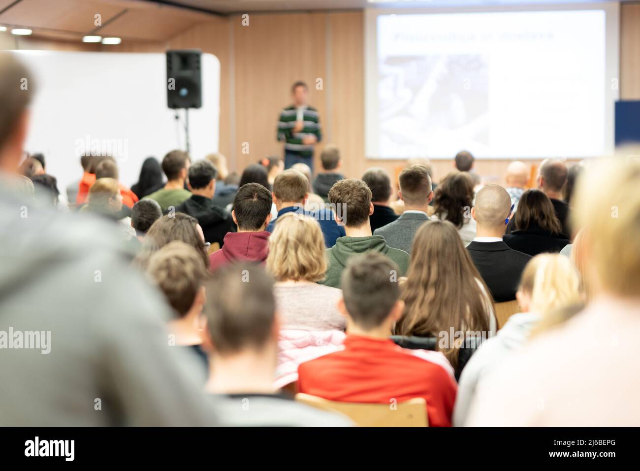 Speaker giving presentation in lecture hall at university Stock Photo ...