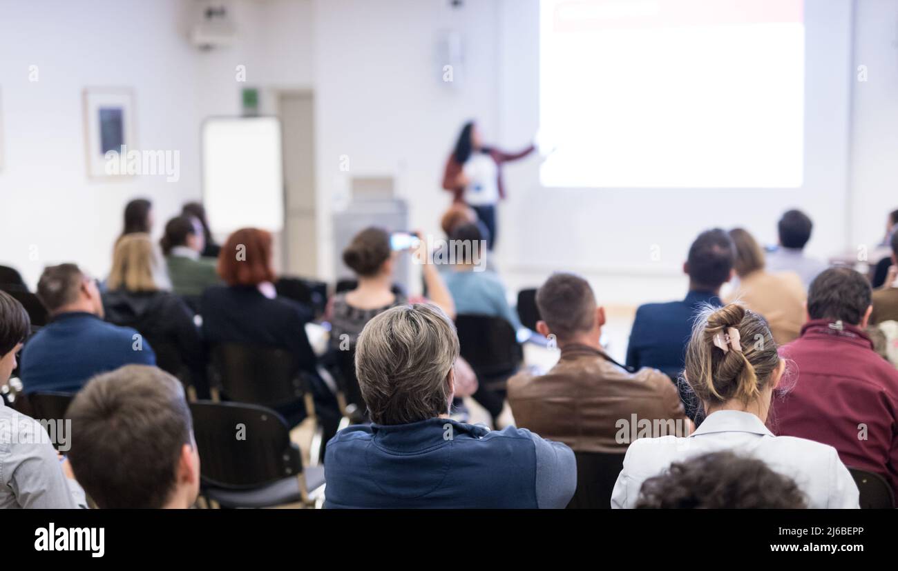 Woman giving presentation on business conference workshop Stock Photo ...