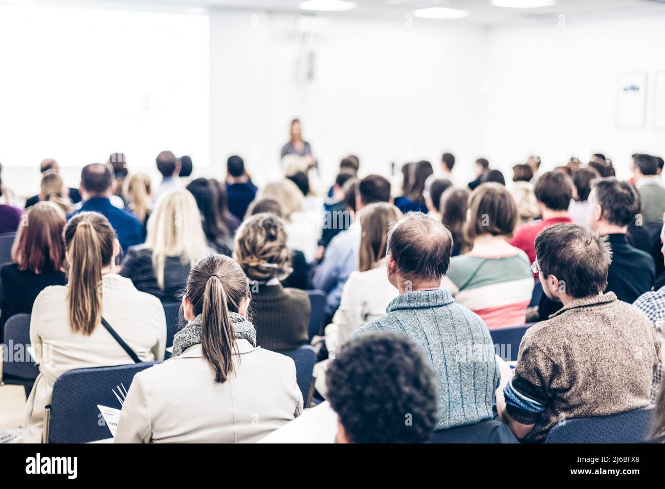 Woman giving presentation on business conference Stock Photo - Alamy