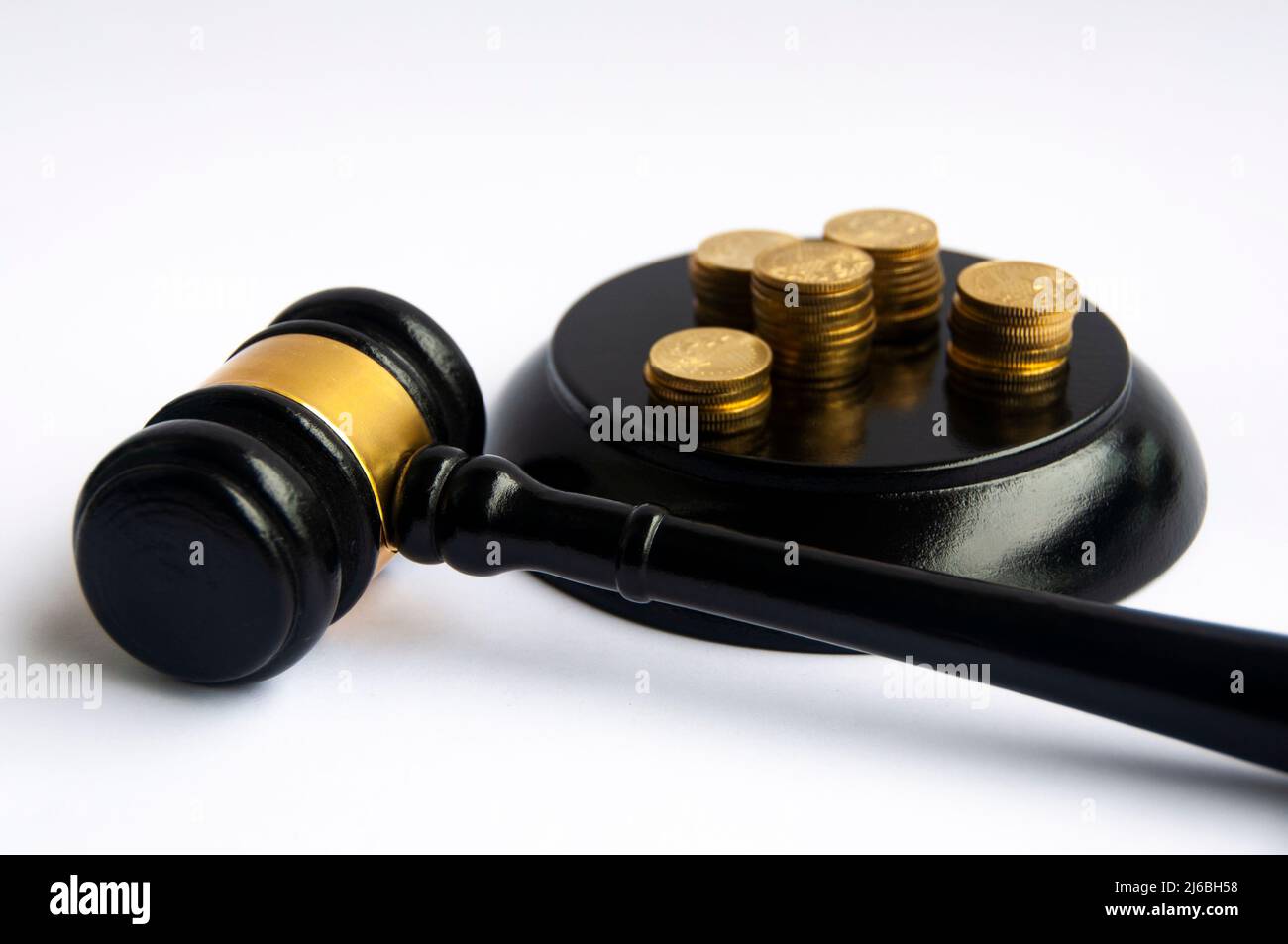 Lawyer gavel on white cover with gold coins background. Law concept ...