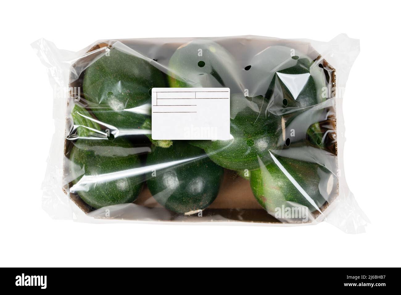 Packed and labeled round zucchini on an isolated white background Stock ...