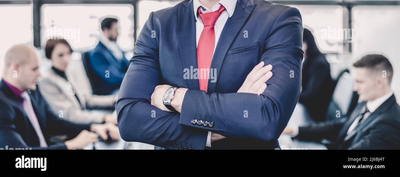 Team leader with coworkers working in office Stock Photo - Alamy