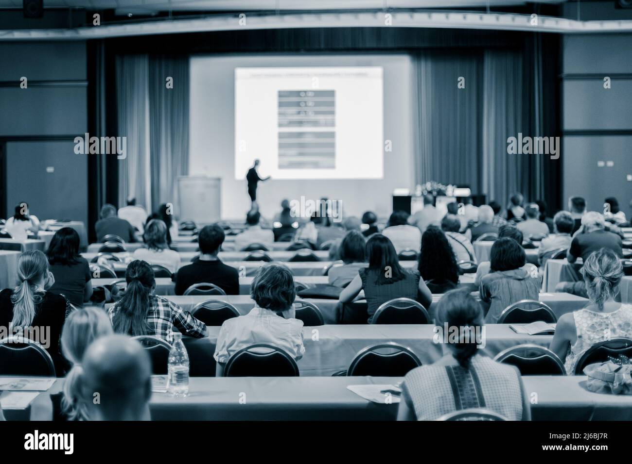 Audience in lecture hall participating at business conference Stock ...