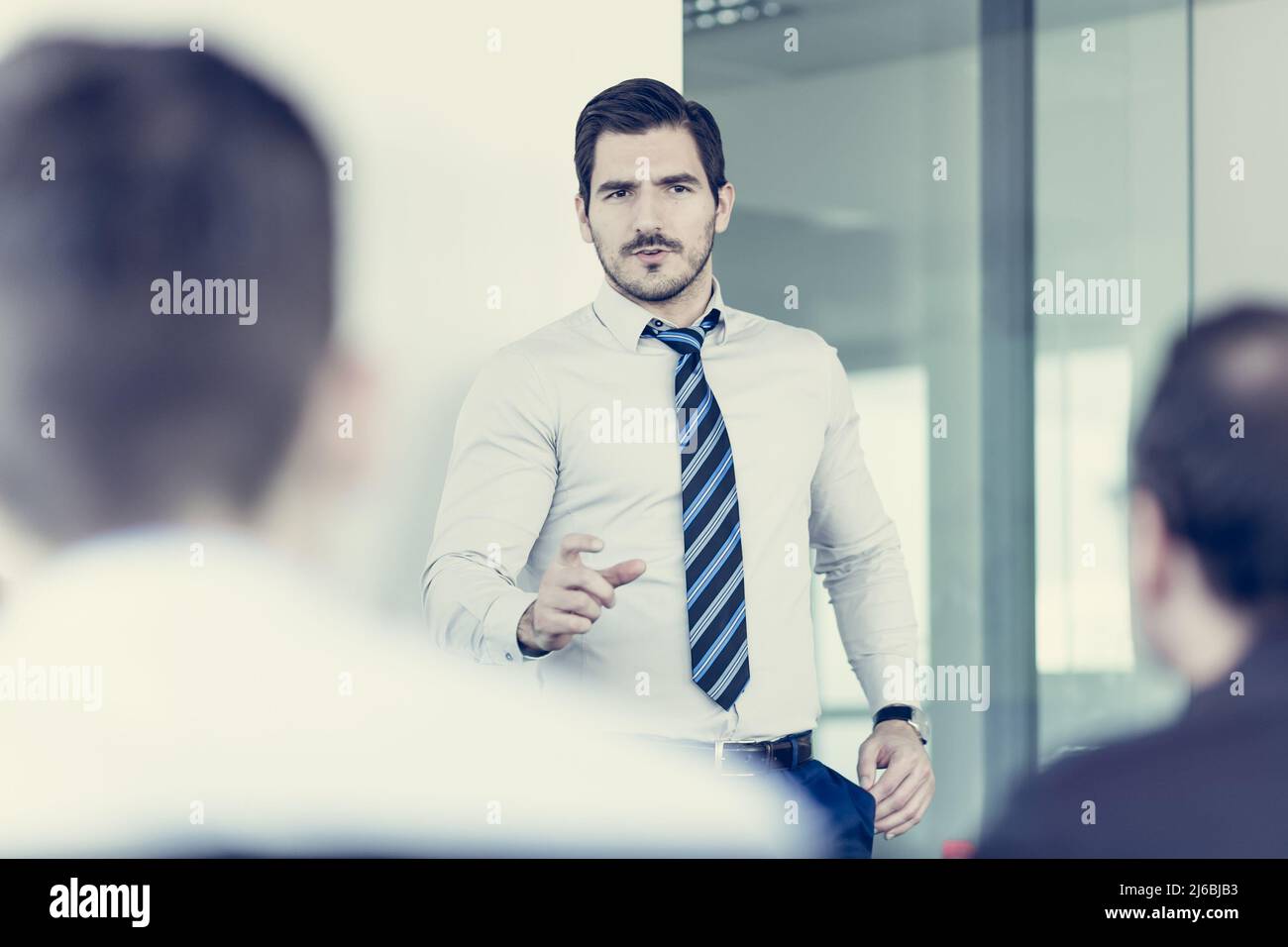 Team leader making presentation on corporate business meeting Stock ...